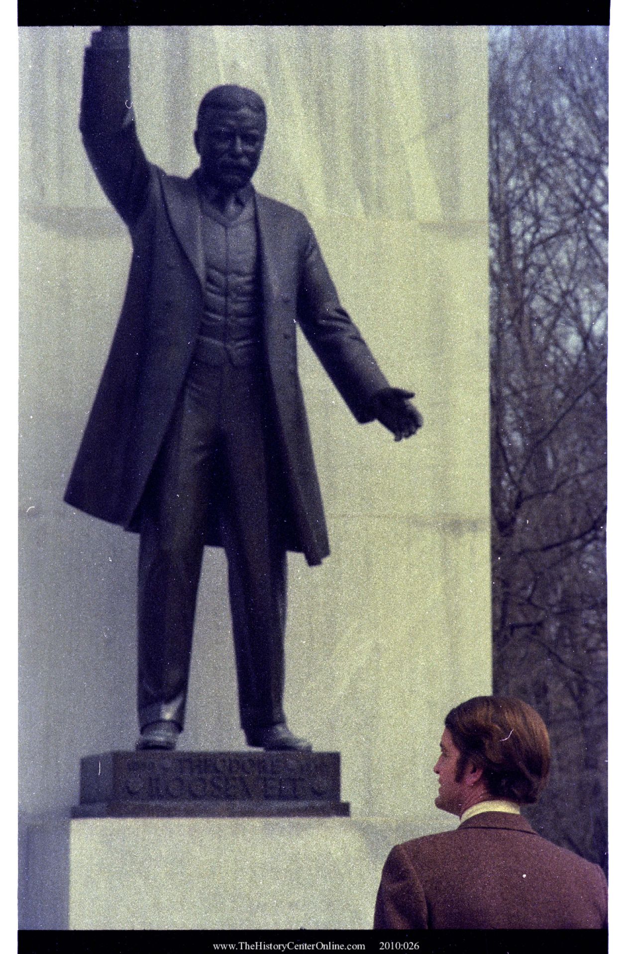 Charlie Wilson in front of a Statue of Theodore… | The History Center